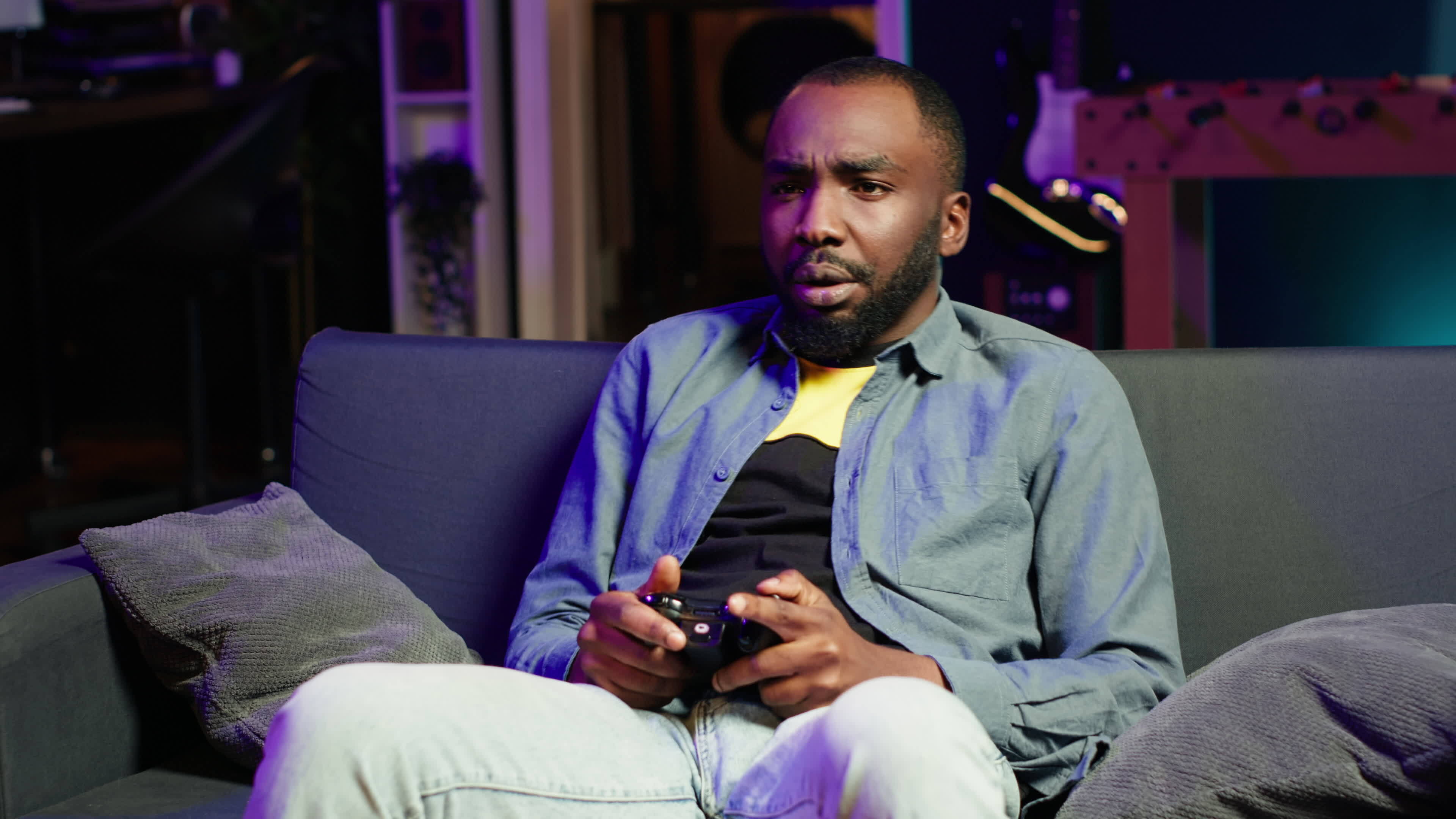 Gamer Upset After Losing While Playing Videogames On Console System Using Controller Man