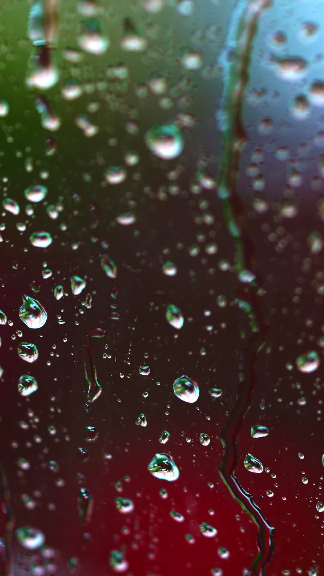 Rainy background on glass. Raindrops on window on blur background of bright dots. Drops of rain ...