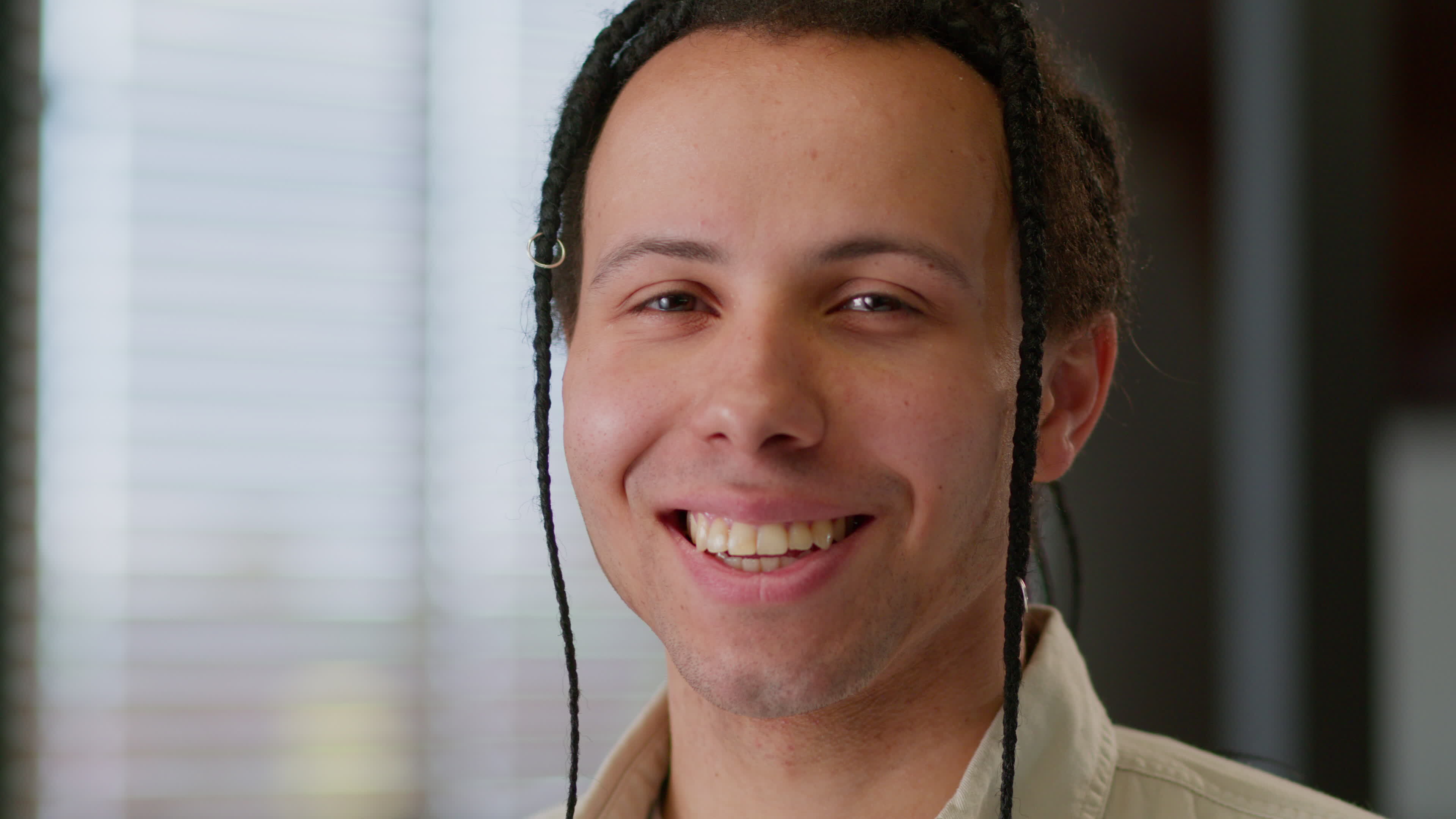 Young portrait at office happy smiling informal hipster Hispanic business man ethnic Caucasian ...