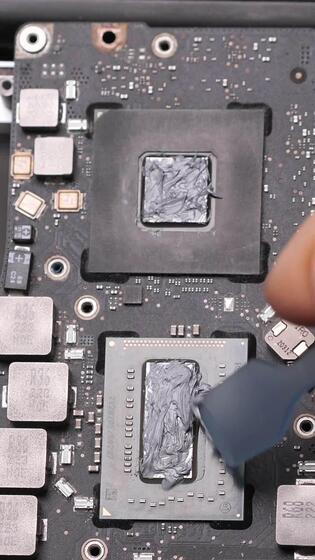 vertical Repairman applying thermal paste on computer motherboard ... vertical Repairman applying thermal paste on computer motherboard ...