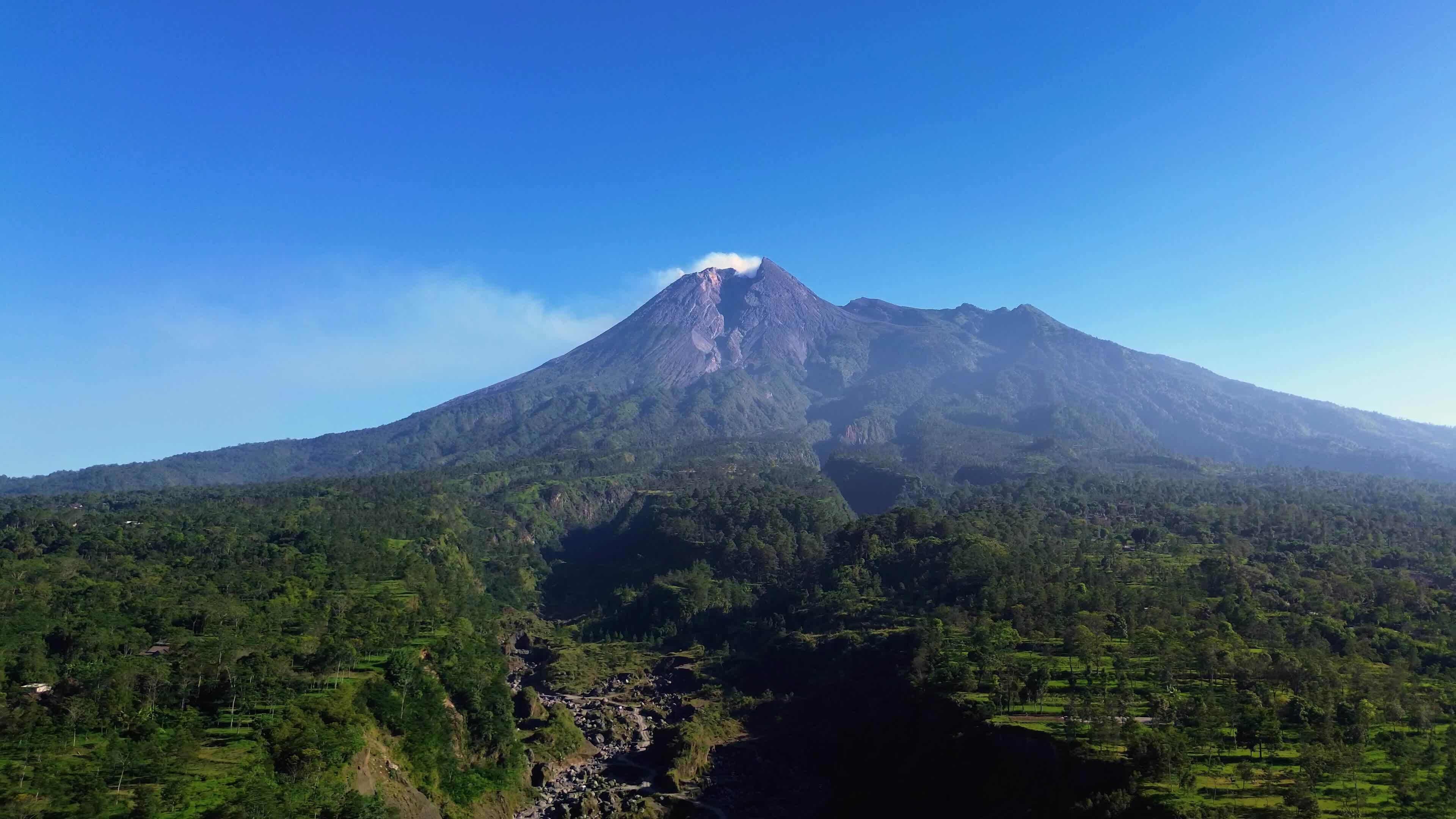 Panoramic aerial drone footage of Mount Merapi from close range with ...