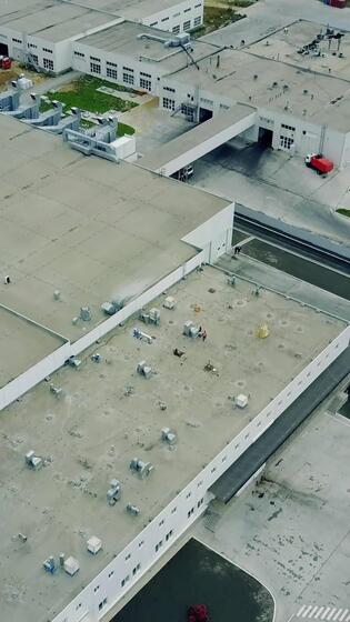 Industrial Factory Building. Aerial view of modern industrial exterior ...