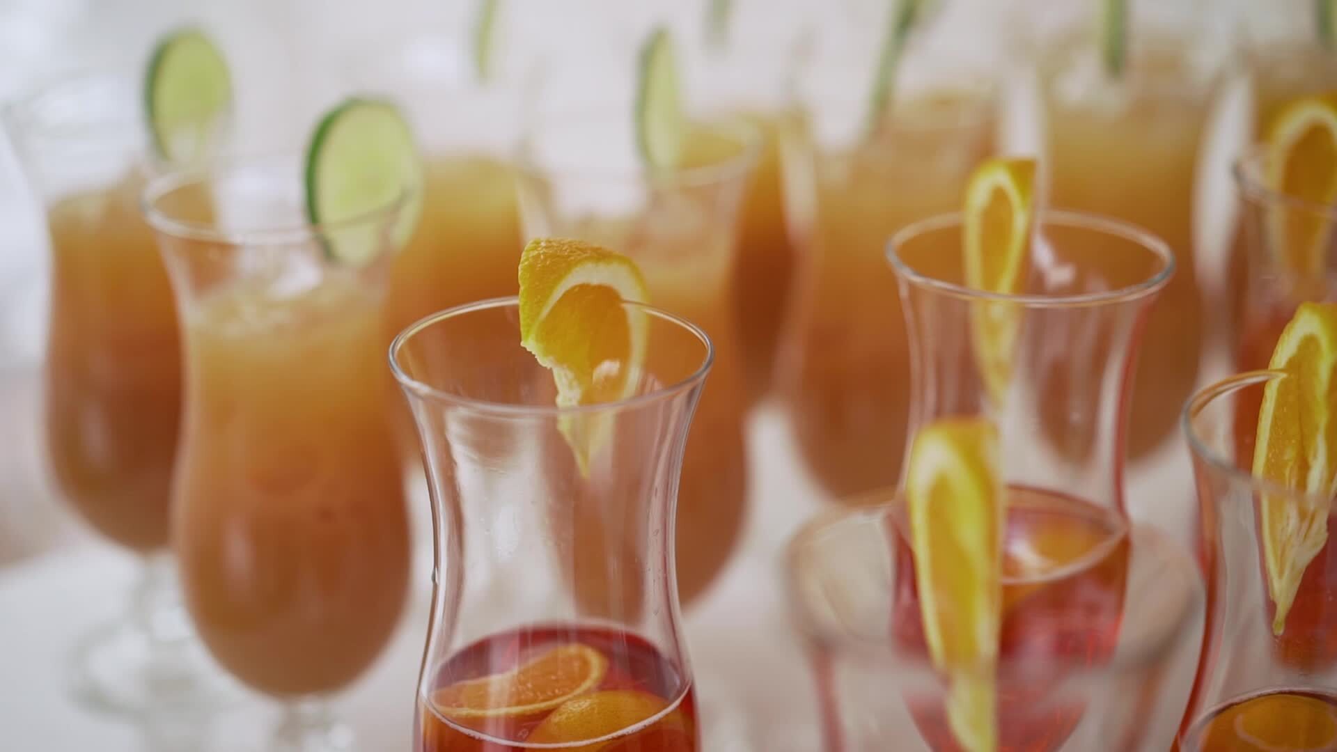Orange Cocktails in Cocktail Glasses. bartender pours a glass of sparkling wine with Aperol ...