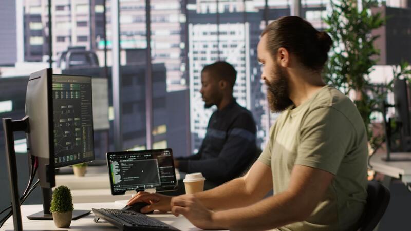 System Administrator Checking Results On Tablet After Creating Complex Machine Learning Models
