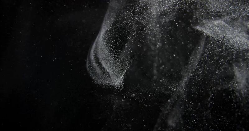 Organic system of dust particles on black screen overlay. Filmed with RED camera in slow motion ...
