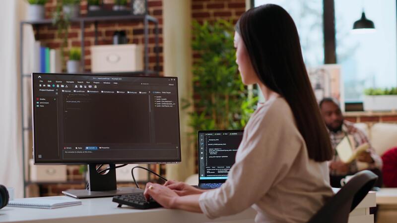 Asian Female Developer Coding Cloud Computing Applications On Pc In A