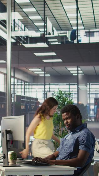 Vertical African american man designing, developing and maintaining ... Vertical African american man designing, developing and maintaining ...