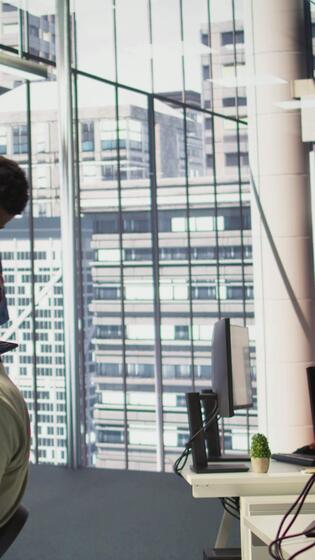 Vertical Technician And Colleague Using Device For Managing Cloud Computing Platforms Training