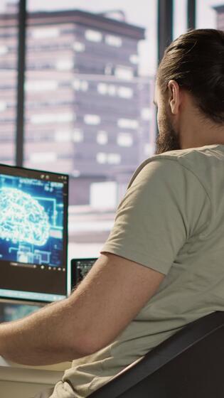 Vertical Employee utilizing AI resources and platforms to train and deploy machine learning ...