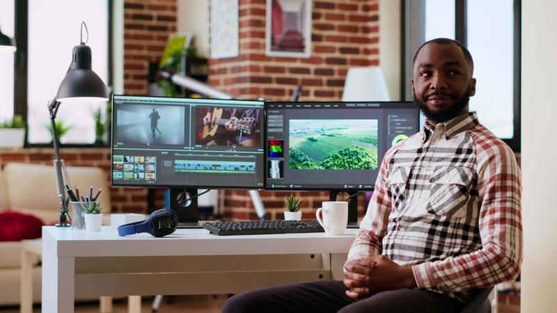 African American Male Filmmaker Works With Creative Editing Software Mixing And Color Grading