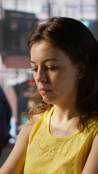 Vertical Portrait Of Smiling Programmer Creating Machine Learning Models That Can Process And