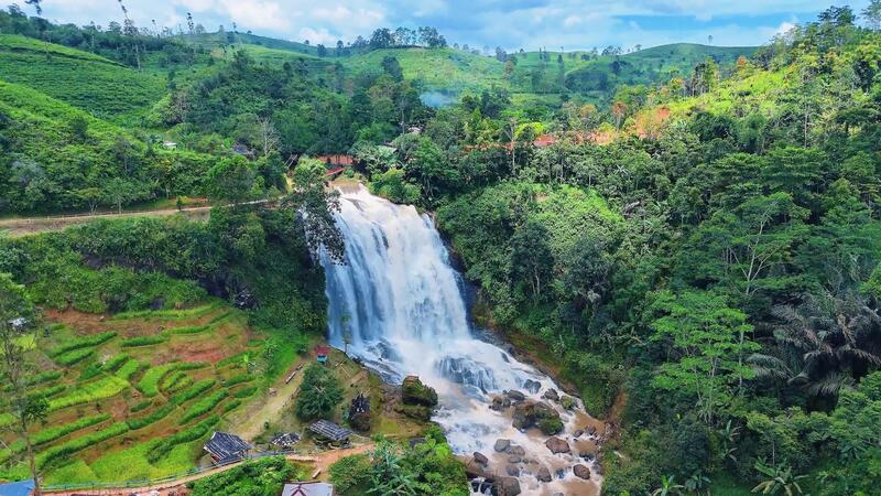 Aerial View Of Lush Green Forest With Breathtaking Waterfall Curug Cikondang Cianjur West Java