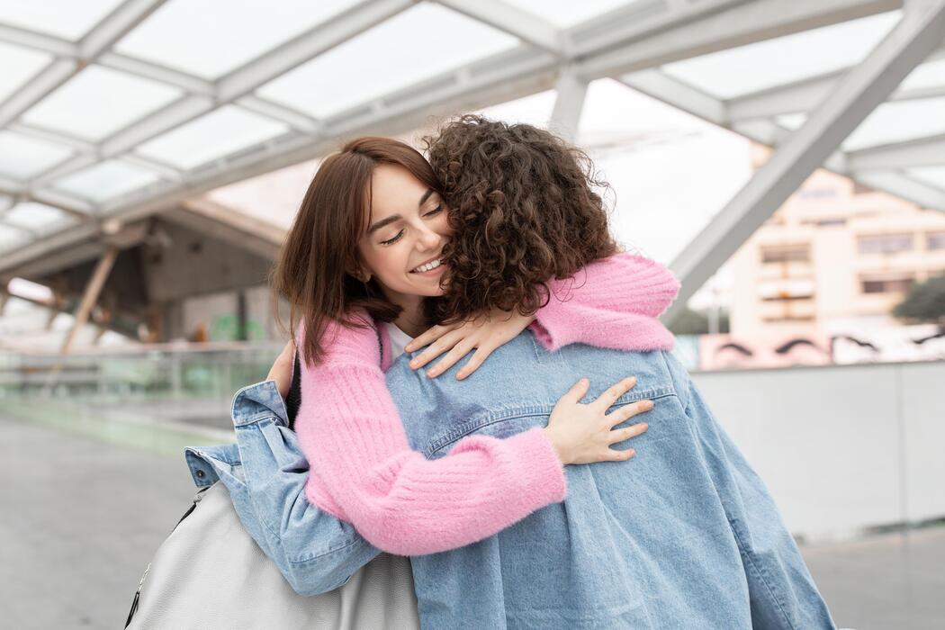 Two People Hugging Stock Photos, Images and Backgrounds for Free Download