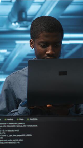 Vertical Portrait Of Happy Manager Supervising Server Rows In Computer Network Security Data