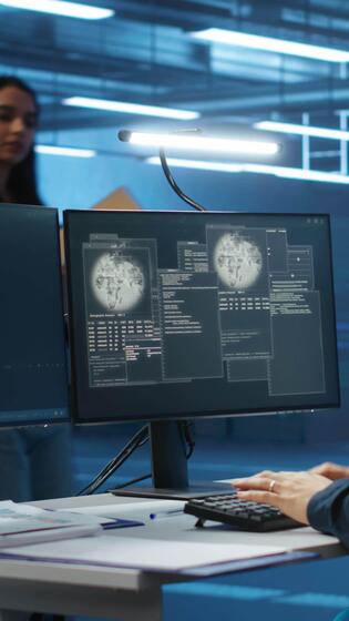 Vertical System administrator in server room workplace requesting assistance from colleagues ...