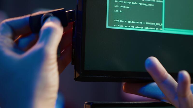 Hacker Inserting Usb In Computer After Managing To Steal Sensitive Data Close Up Scammer