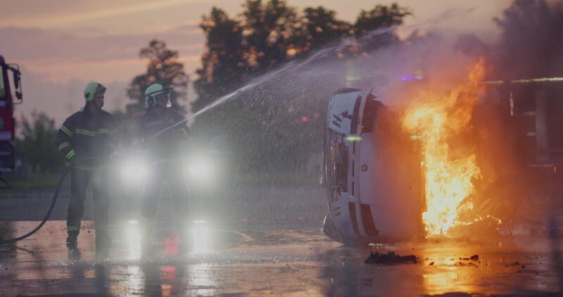 Firefighters fight the fire flame to control fire not to spreading out ...