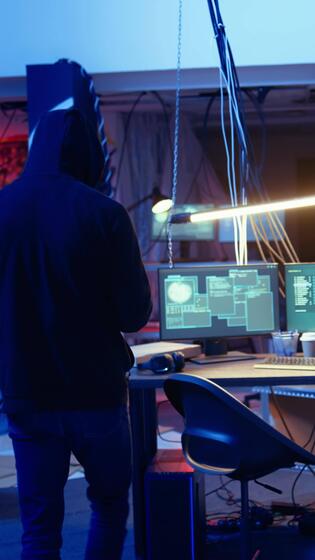 Vertical Hacker Arriving With Tablet In Hidden Base Deploying Viruses On Unaware Victims