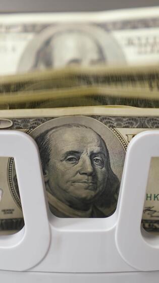 Counting process of dollar banknotes. Automated financial operations ...