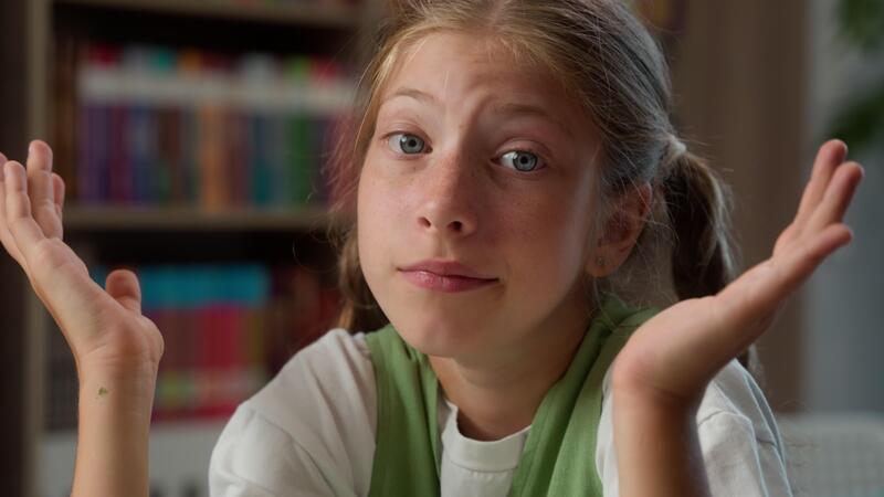 Child Shrugging Shoulders