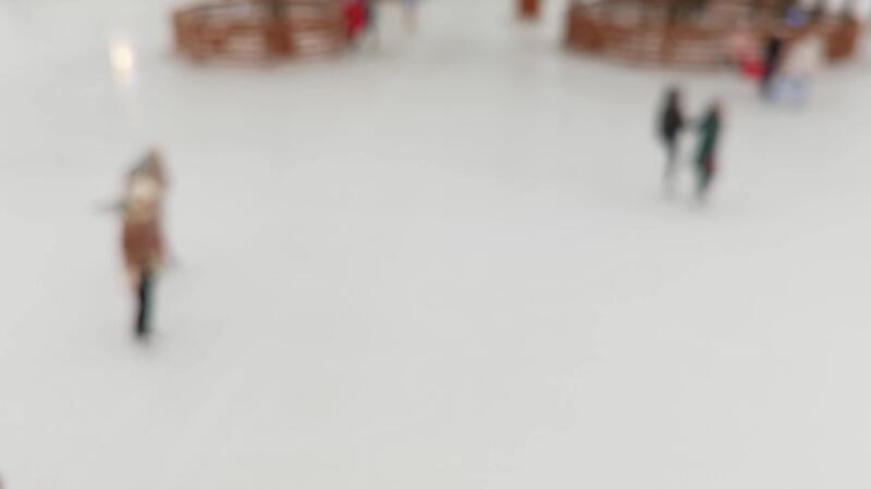 Graceful ice skating in winter wonderland at busy rink capturing ...