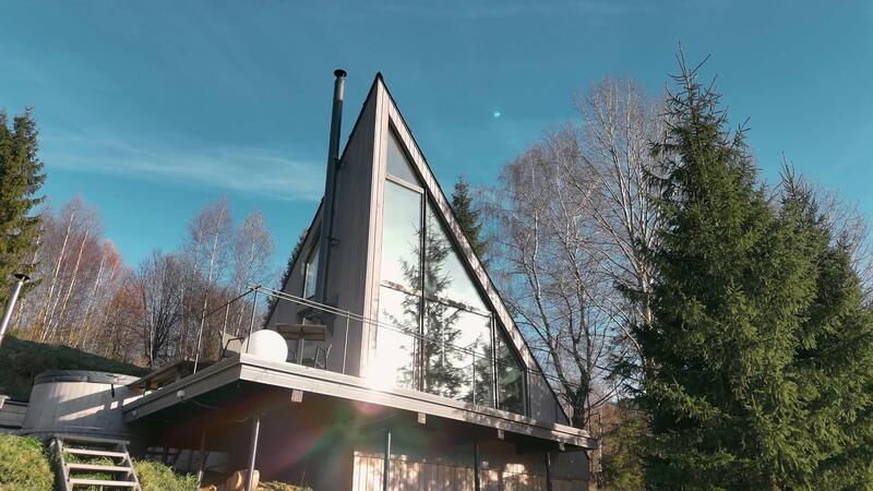 A-Frame Cabin with Glass Facade. Modern A-frame cabin featuring a large ...