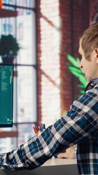 Graphic designer designing UX for AI software turning text prompt into photos. IT specialist in ...