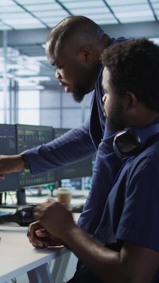 Vertical Data center manager helps intern implement AI predictive maintenance systems. Server ...