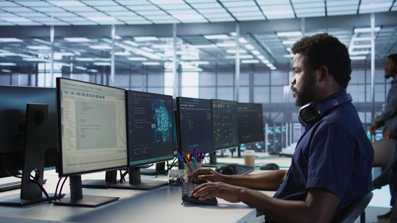 Woman Assisting Data Center Programmer In Solving Tasks Maintaining
