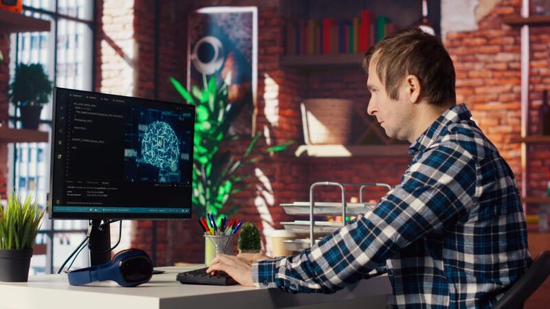 Teleworking Programmer Using Computer For Artificial Intelligence