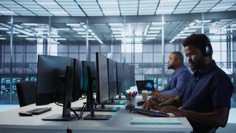 Data Center Admin Typing On Keyboard Maintaining Company Network Infrastructure By Configuring