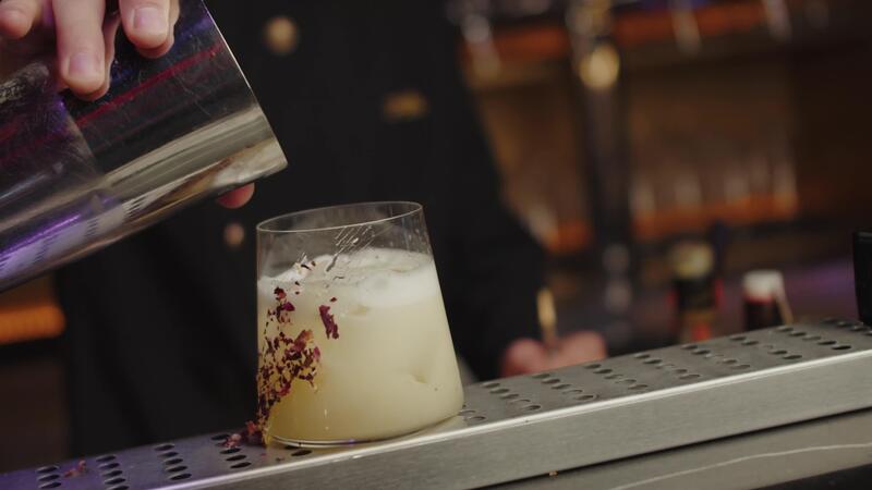 Bartender Pouring Cocktail from Shaker into Glass 54687365 Stock Video at Vecteezy