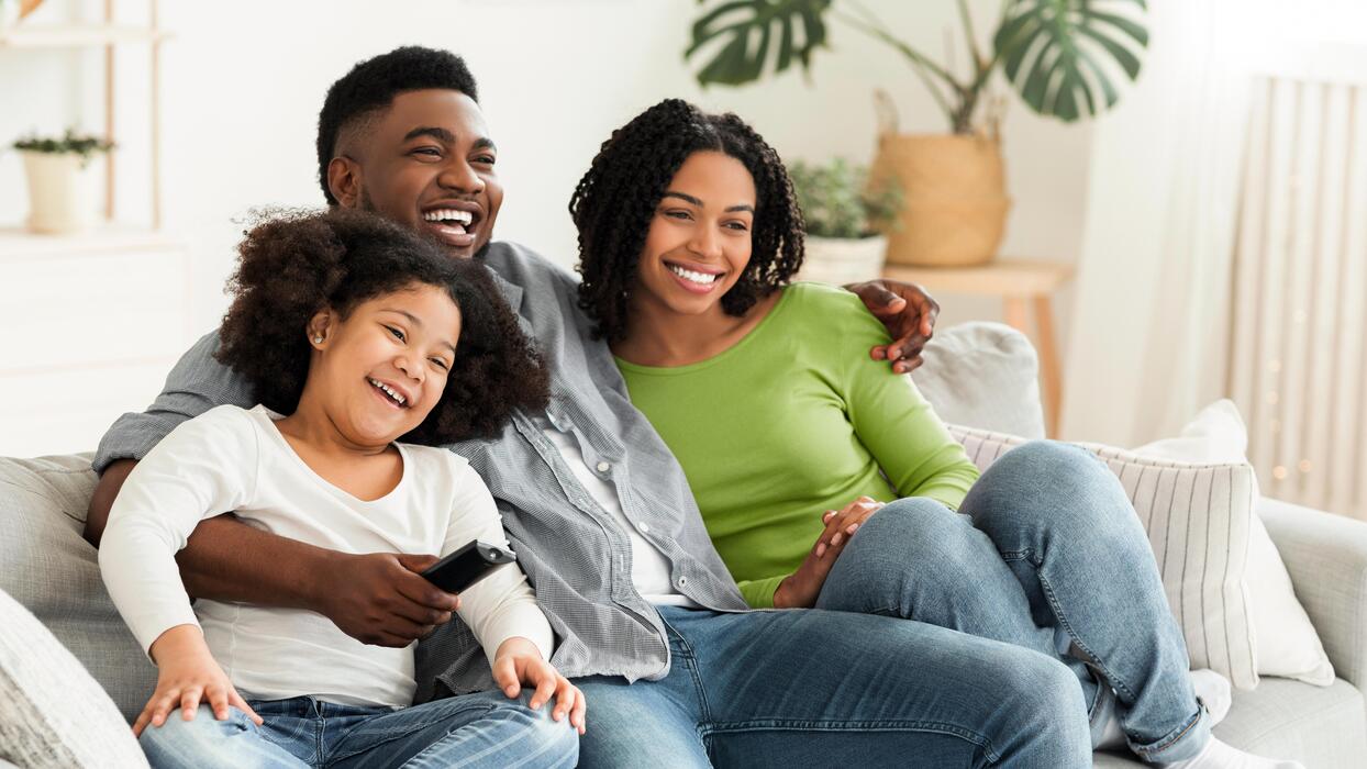African Family Watching Tv Stock Photos, Images and Backgrounds for Free Download