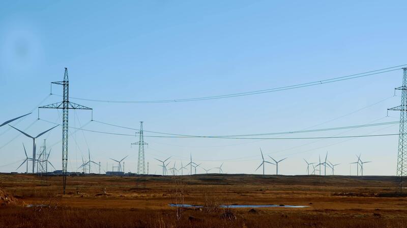 Wind turbine farm is located in northern tundra, where it produces ... Wind turbine farm is located in northern tundra, where it produces ...