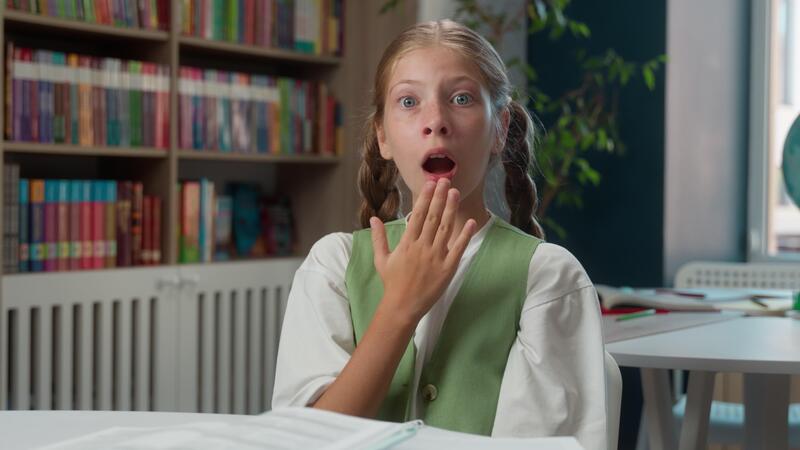 Shocked nervous Caucasian worried little girl school child kid pupil stressed student learner ...