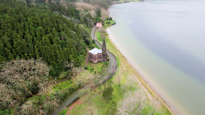 aerial drone footage of the Capela de Nossa Senhoras das Vitorias in Furnas, Sao Miguel Island ...