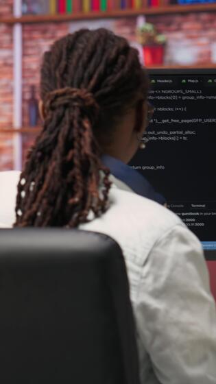 Vertical Admin Writing Code On Computer And Doing Maintenance On