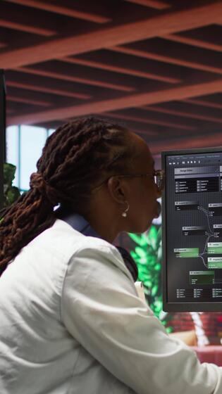 Vertical Teleworking computer scientist at home using PC to develop artificial intelligence self ...