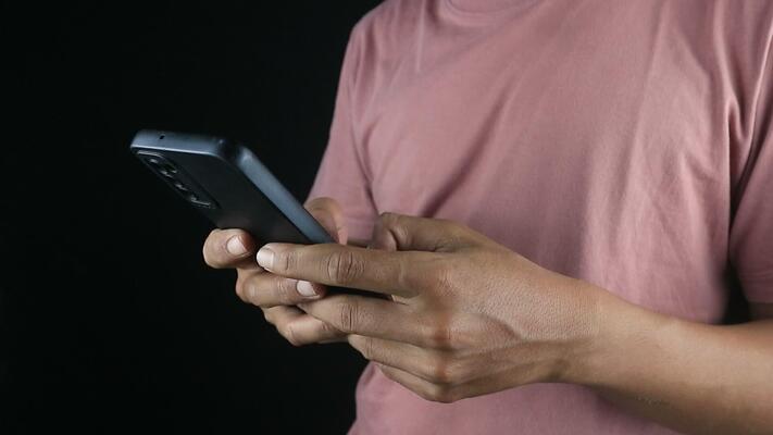 Person Scrolling On Phone Stock Video Footage for Free Download