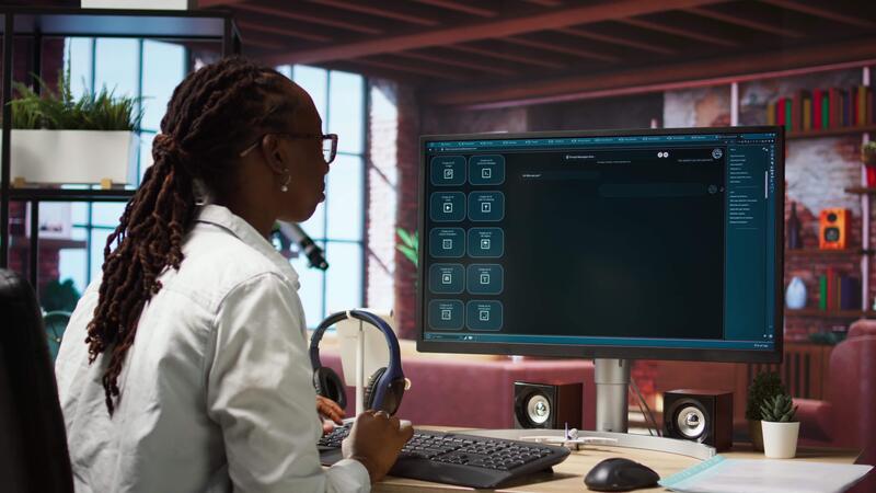 Woman at home asks questions to AI LLM chatbot virtual assistant answering user prompts. Person ...