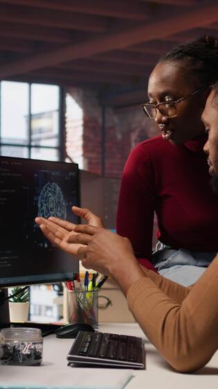 Vertical Team Of Startup Admins Doing Brainstorming Working With Machine Learning Tech