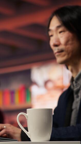 Vertical Senior Admin Working In Innovative Startup Office Using Programming Languages To Build