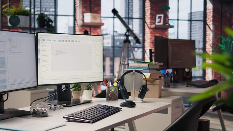 Advanced Ai Algorithms Running On Computer Monitors In Empty Startup Workspace Deploying Machine