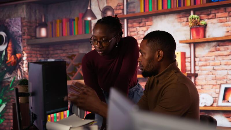 Team Of Startup Workers Conducting Code Review On Pc To Fix Bugs