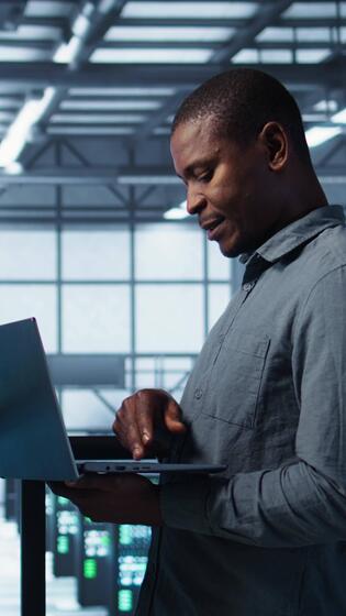Vertical Developers In Data Center Using Laptop And Tablet Executing