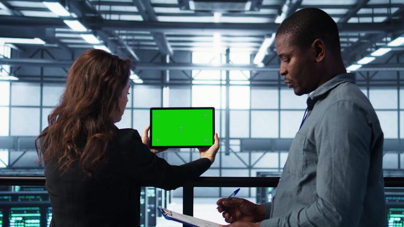 System Administrators In Server Farm Using Isolated Screen Mockup Tablet To Verify Settings