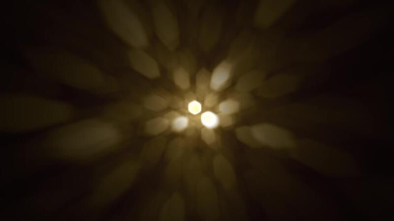 Defocused golden bokeh lights background. This elegant motion background animation with ...