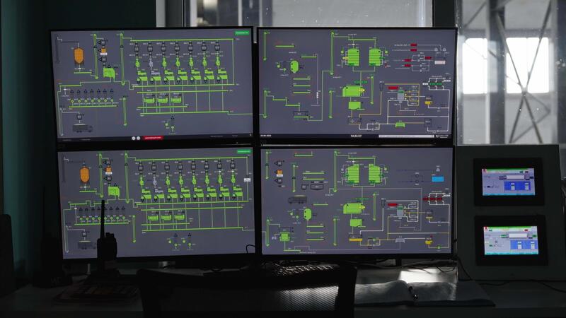 Industry 4.0 Modern Factory. Multiple monitors with control panel of a ...