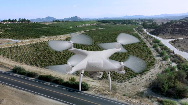 Real UAV Quadcopter Drone Flying Outdoors Over Grape Vineyards. 59031033 Stock Video at Vecteezy