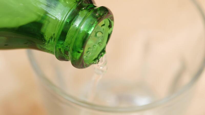 Pouring sparkling water into a glass with ice 59591669 Stock Video at Vecteezy